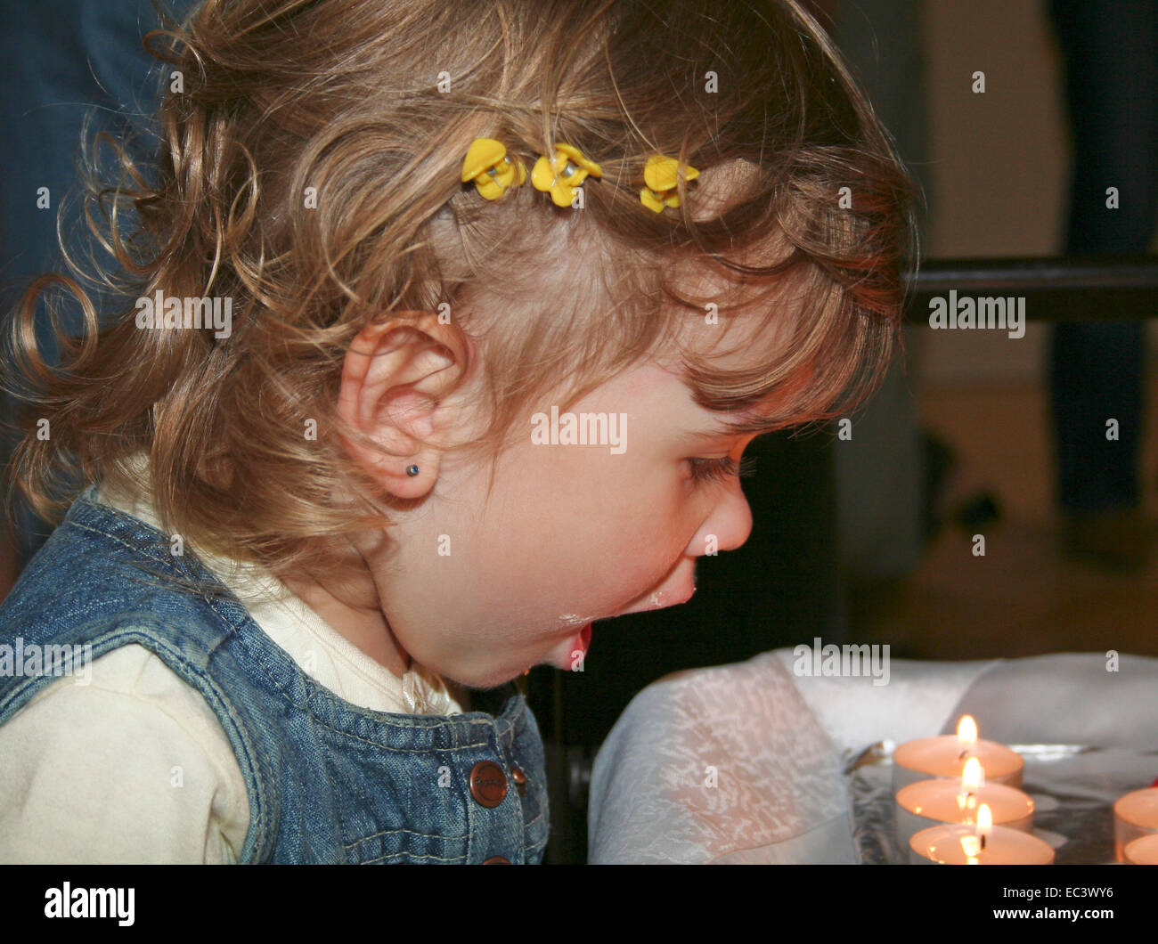 Little Child Gazing at Candles Stock Photo - Alamy
