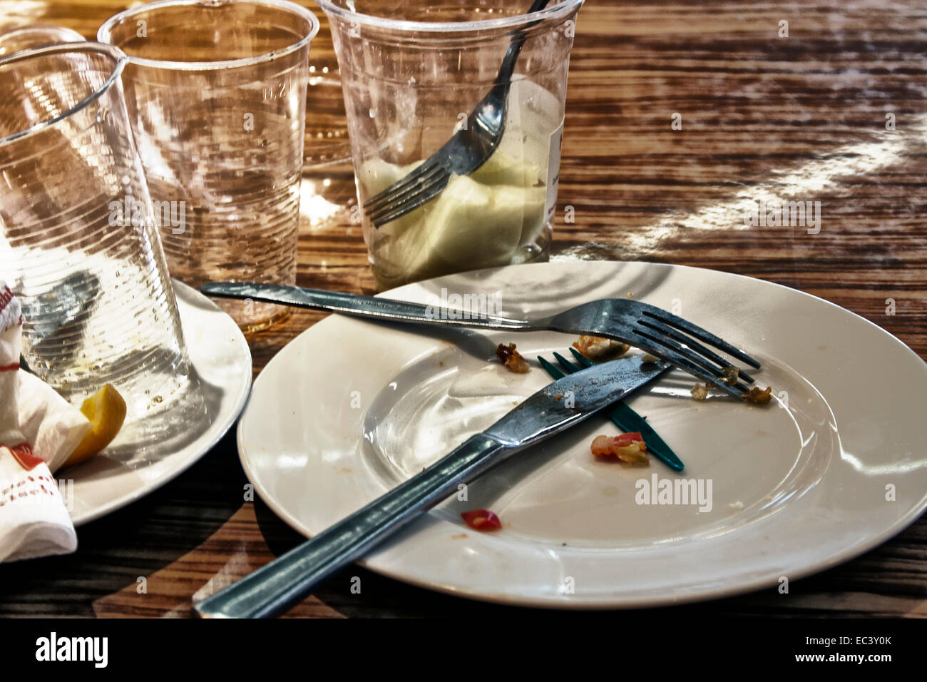Remains of food and dishes on a table Stock Photo - Alamy