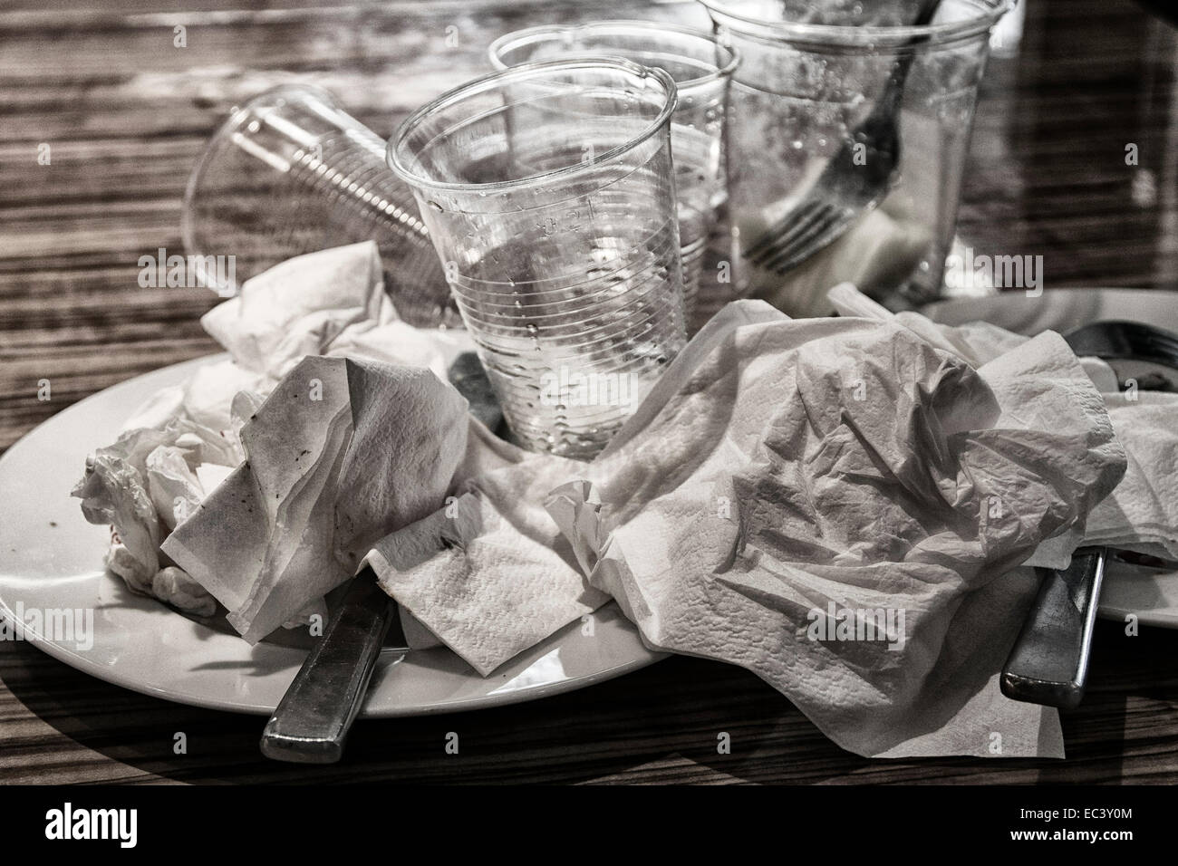 Remains of food and dishes on a table Stock Photo - Alamy