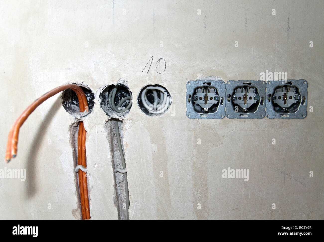 Plug sockets and cables in an incomplete new building Stock Photo - Alamy