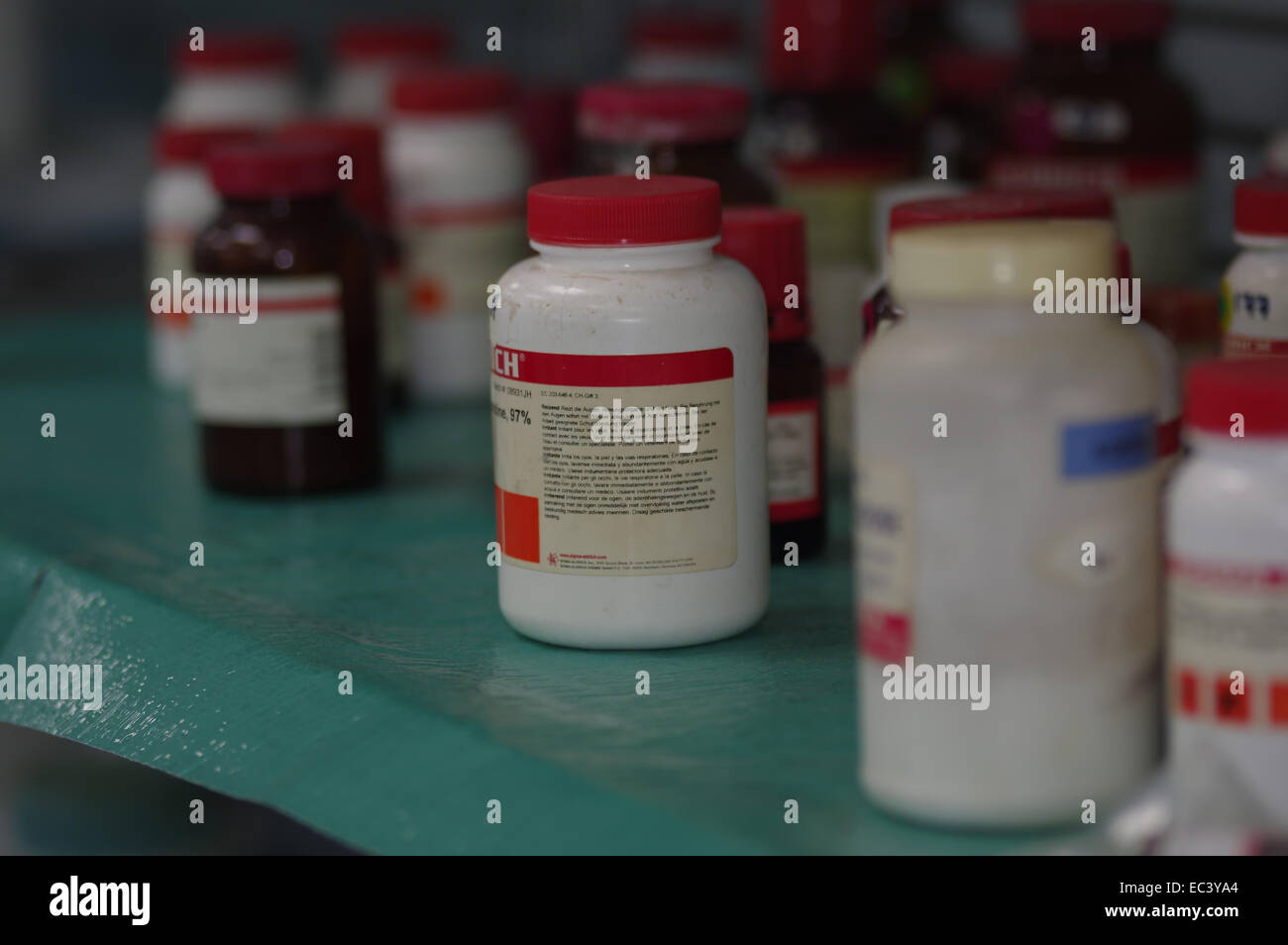 Bottled chemicals on laboratory shelves Stock Photo - Alamy