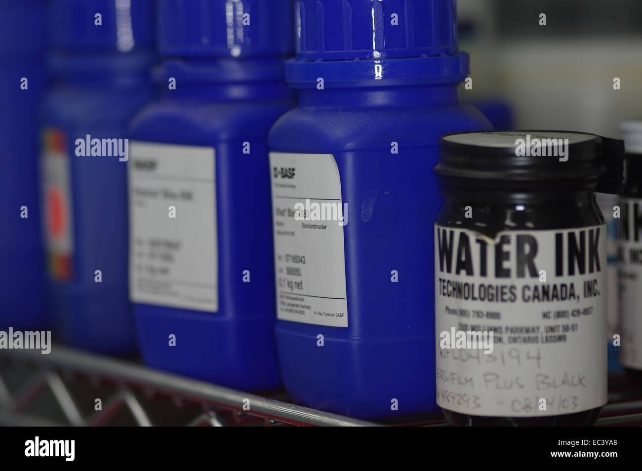 Bottled chemicals on laboratory shelves Stock Photo - Alamy