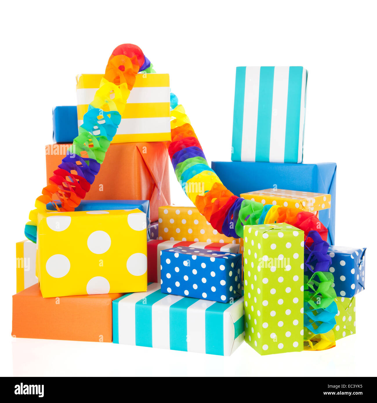 Many festive colorful wrapped presents with paper chain isolated over ...
