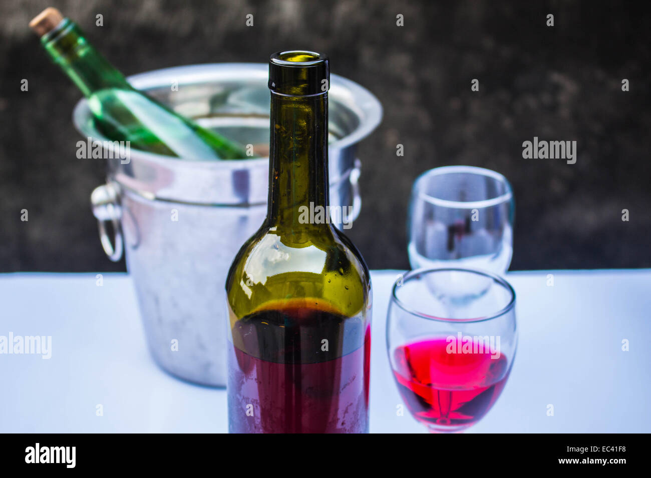Opening a wine bottle on a table at a party Stock Photo - Alamy