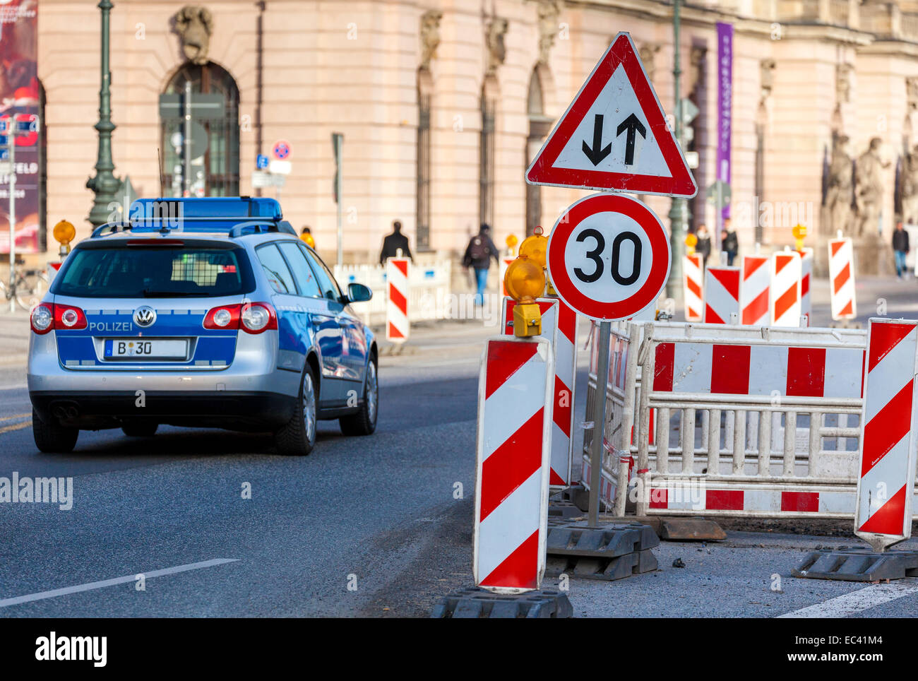 Police vehicle on a construction site with speed limit Stock Photo - Alamy