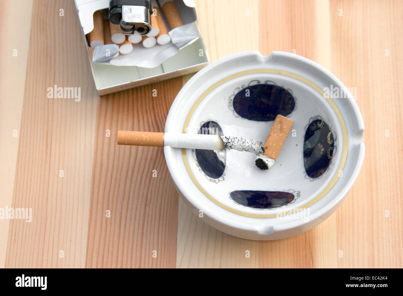 Glowing Cigarette lying in Ashtray Stock Photo - Alamy
