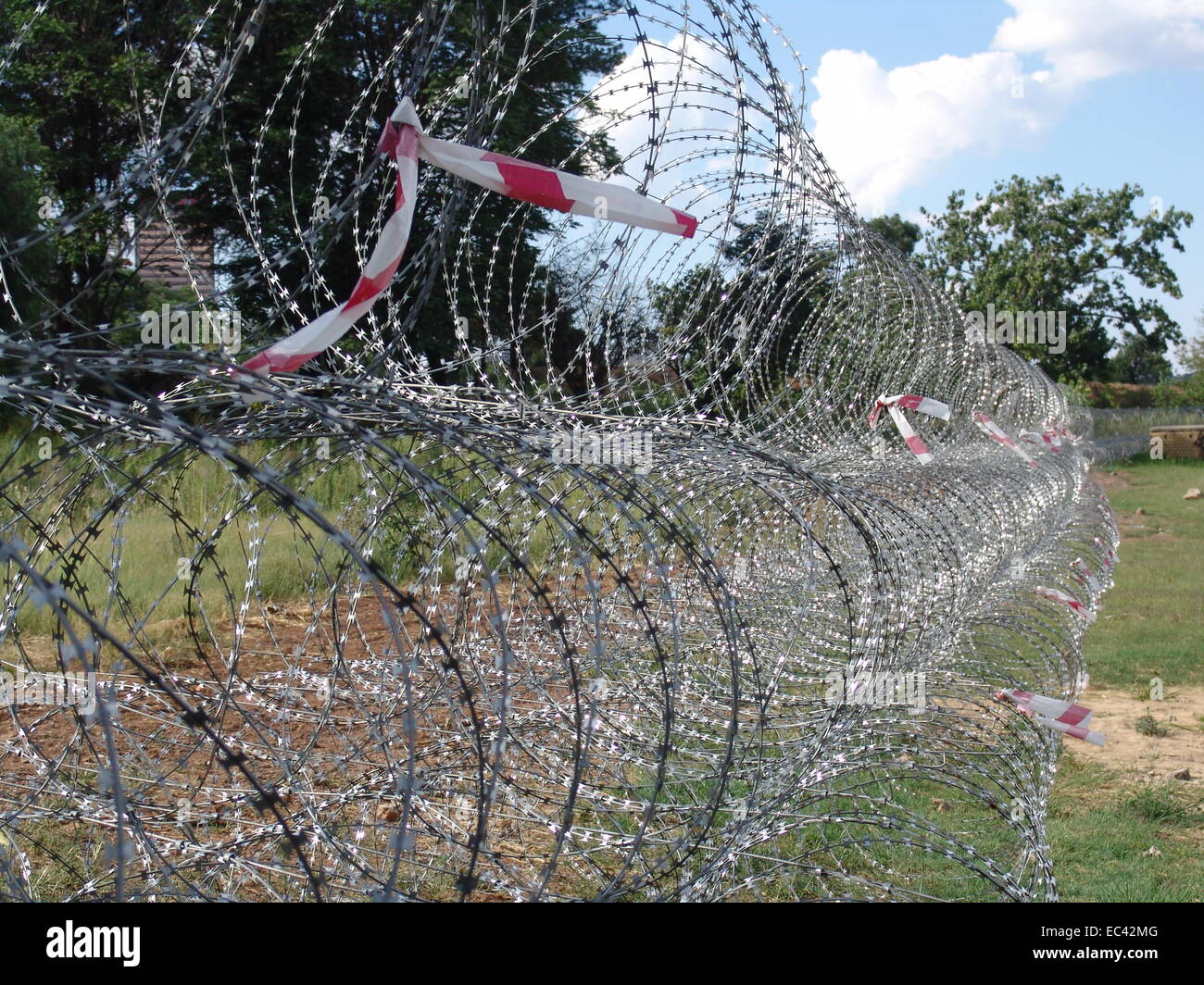 Barb barbed razor wire fence fences hi-res stock photography and images ...