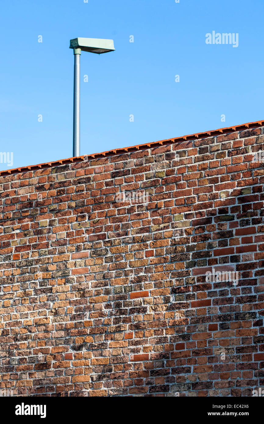 House hidden behind stone wall hi-res stock photography and images - Alamy