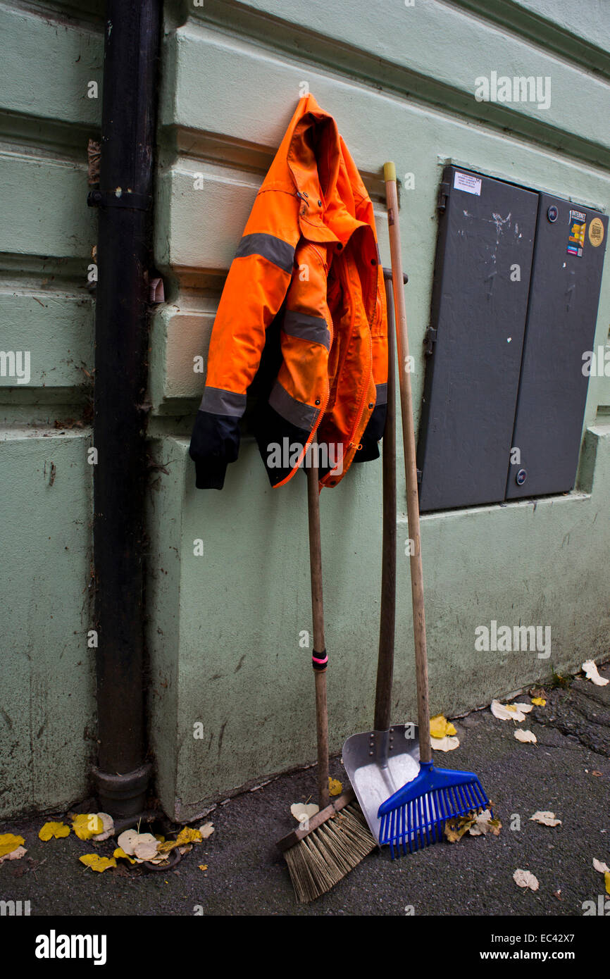 street sweeper worker tools and orange uniform Stock Photo - Alamy