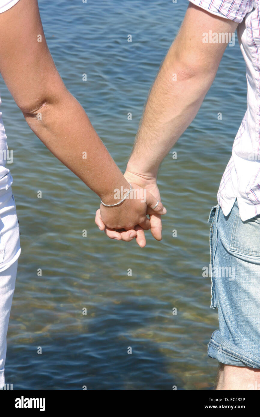 at lovers holding hands Stock Photo - Alamy