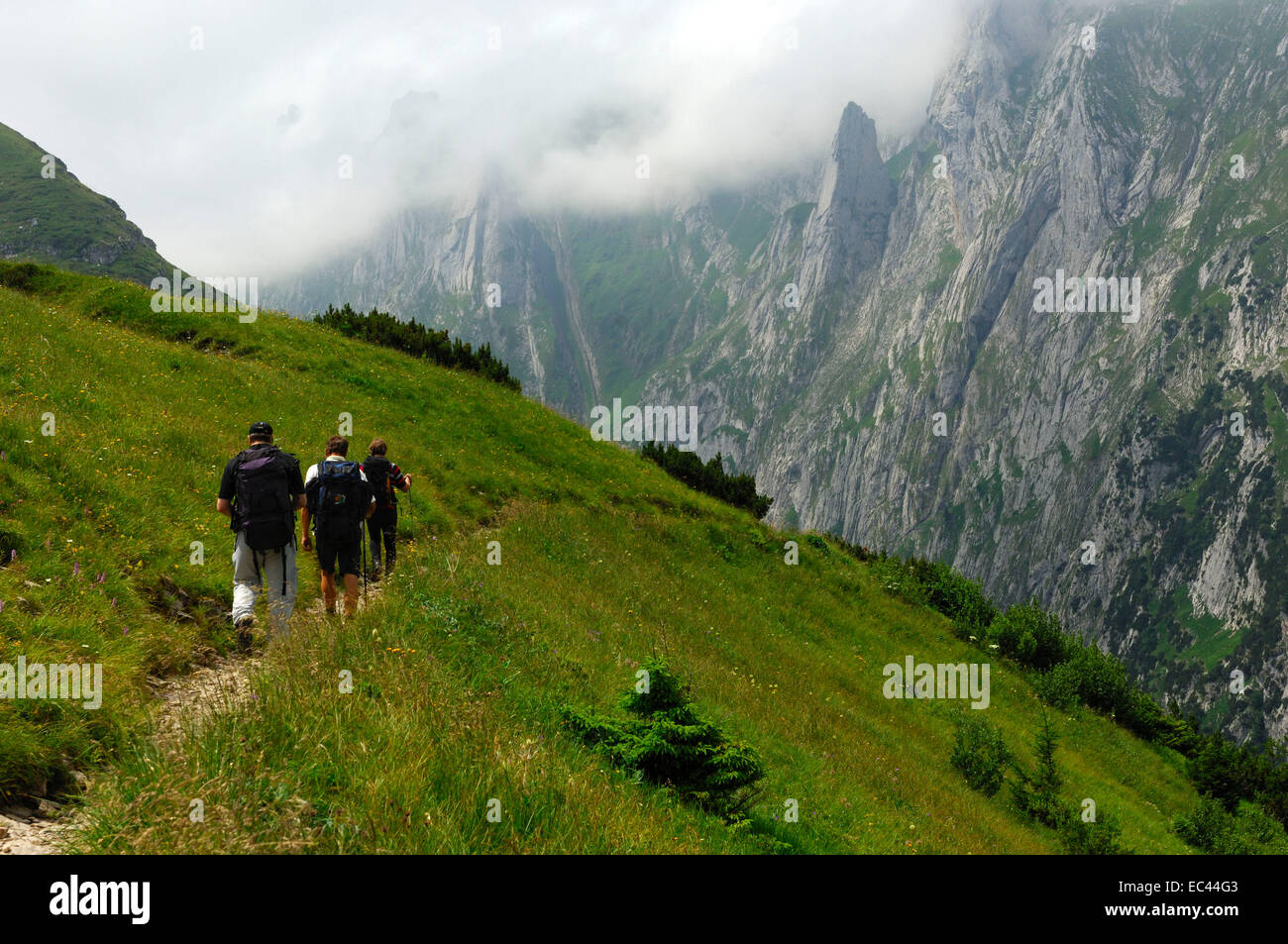 Hikers in the hiking area Alpstein mountain range, canton of Appenzell ...