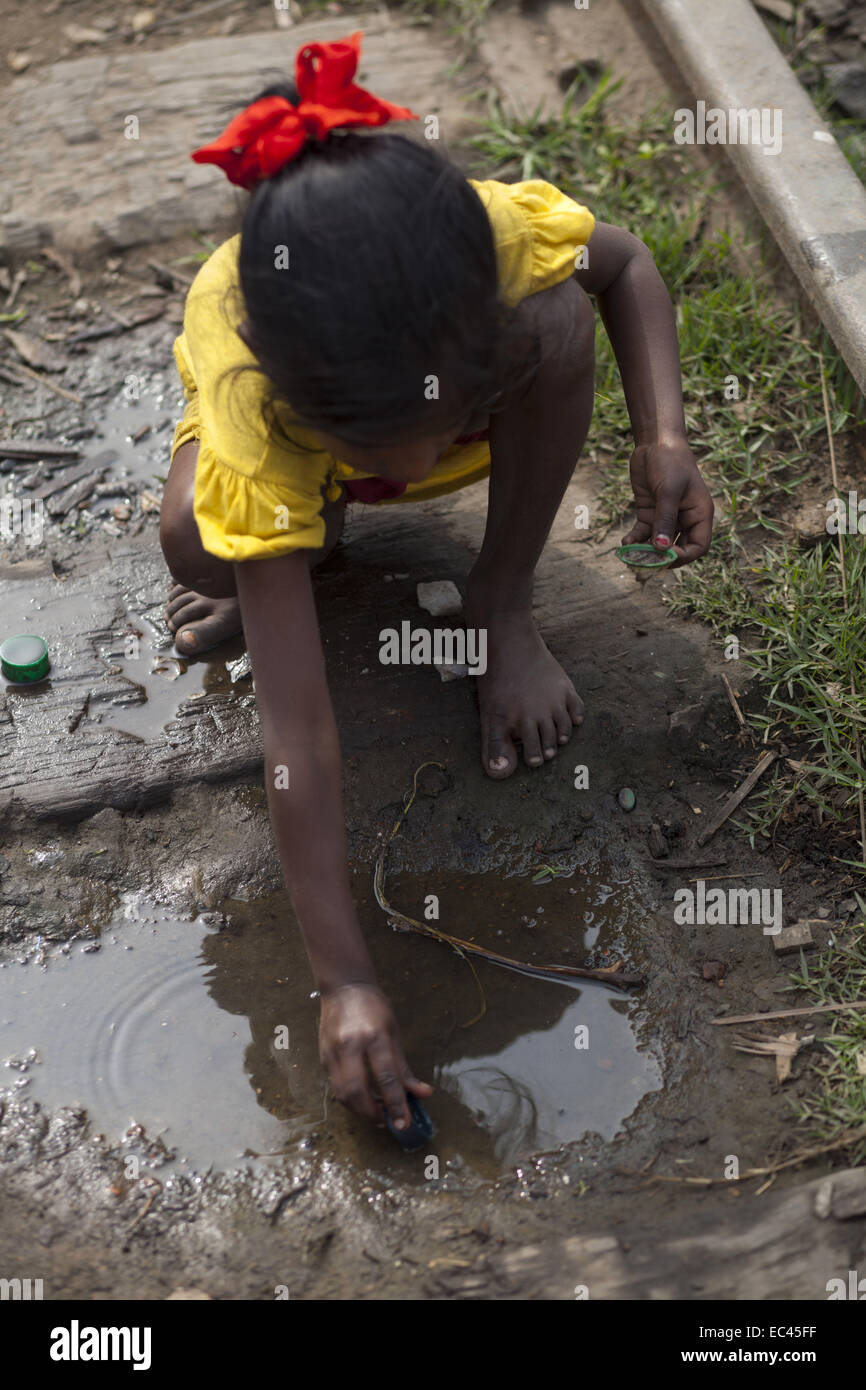 Dhaka, Bangladesh. 9th Dec, 2014. Slum child Surma playing near rail ...