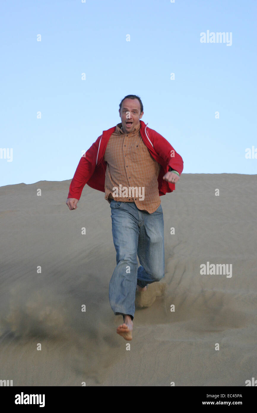 Man running through Sand Stock Photo - Alamy