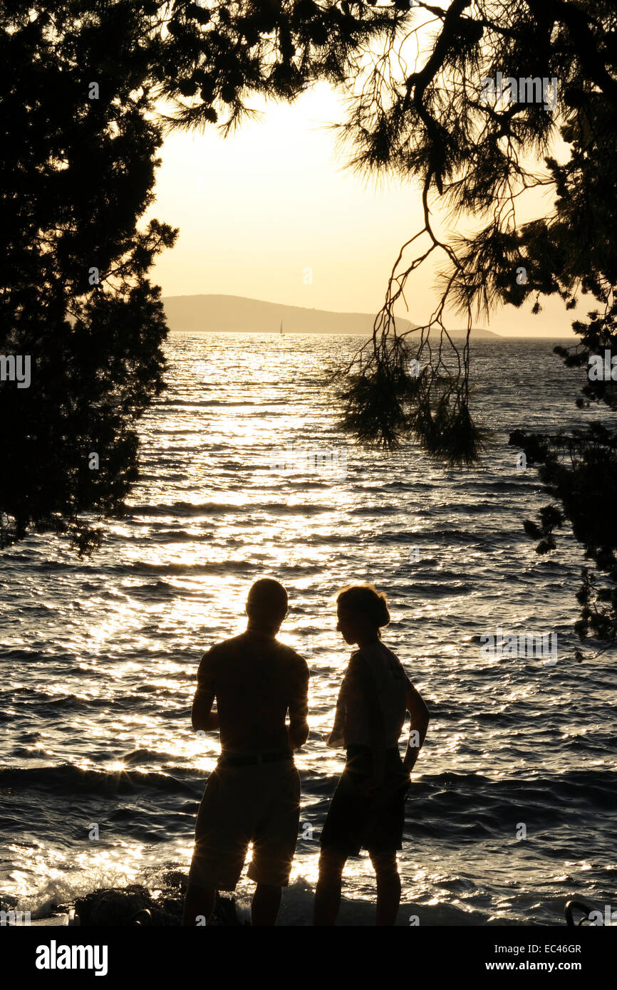 Couple and Sunset Stock Photo - Alamy