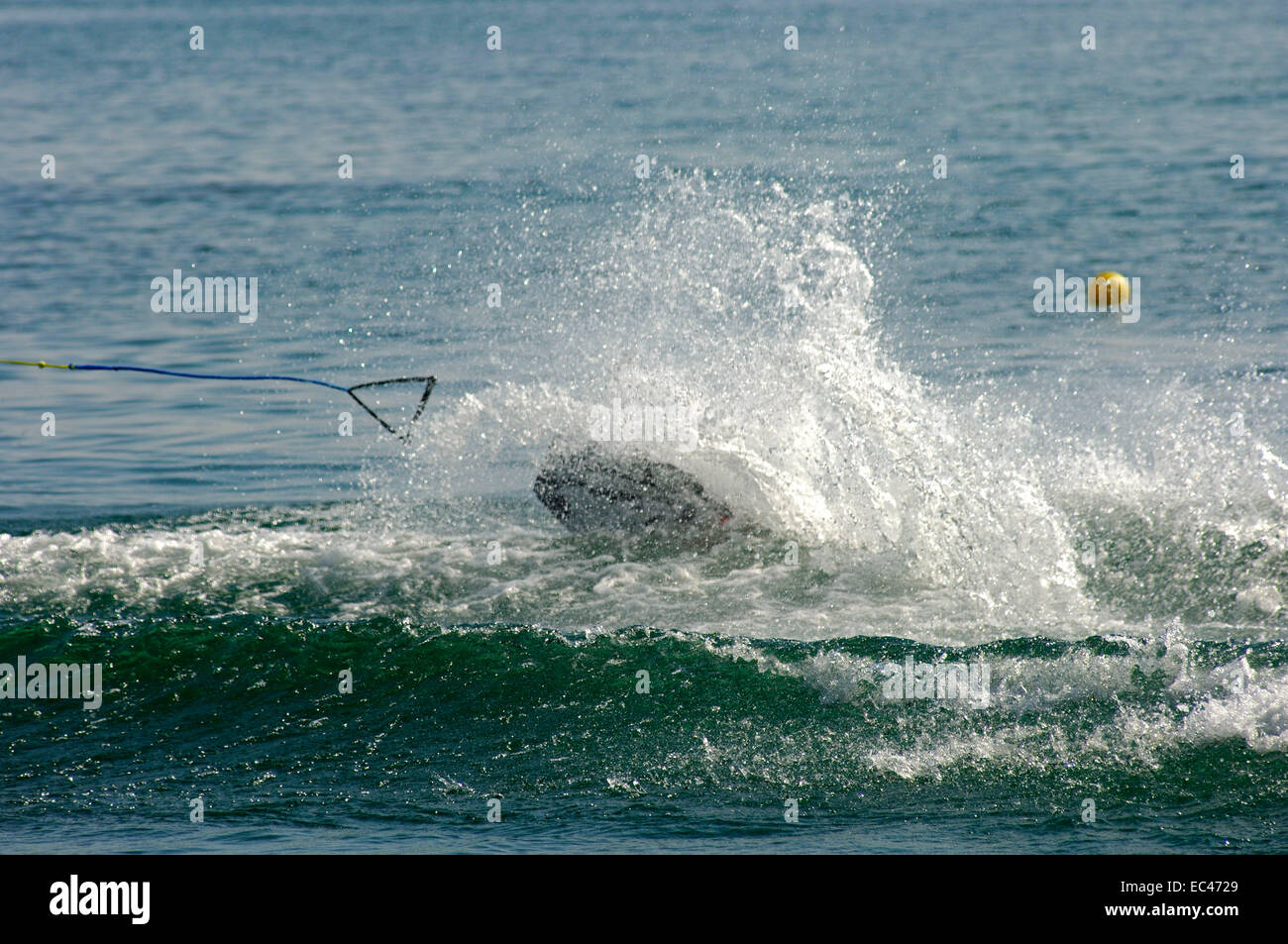 Water skier falling into a lake Stock Photo - Alamy