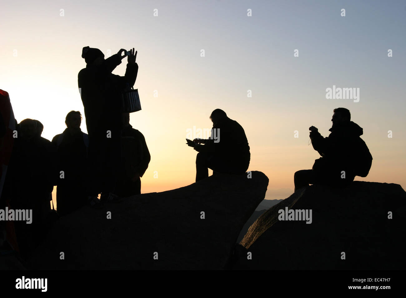 Pilgrim reads the Bible Tourists take photos Mount Sinai, Egypt Stock ...