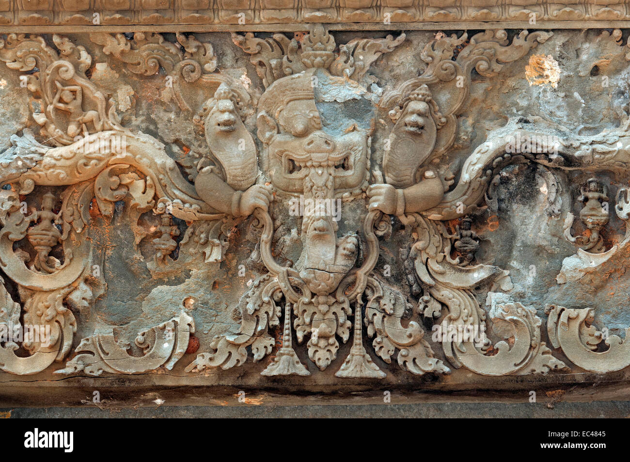 Bas-relief of the mythical demon Kala as sandstone carving, Lolei ...