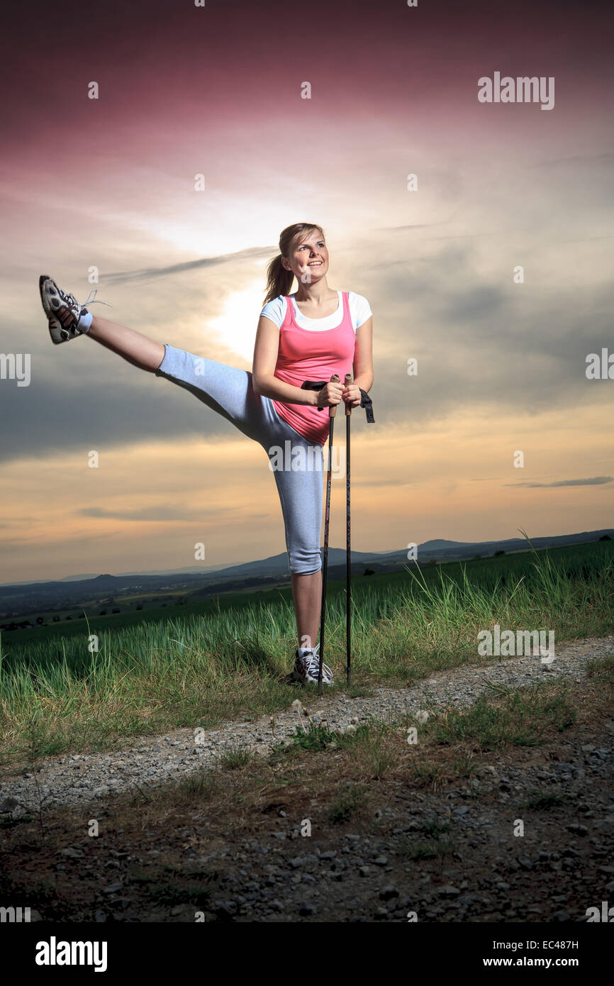 Young woman stretching nordic walking hi-res stock photography and ...