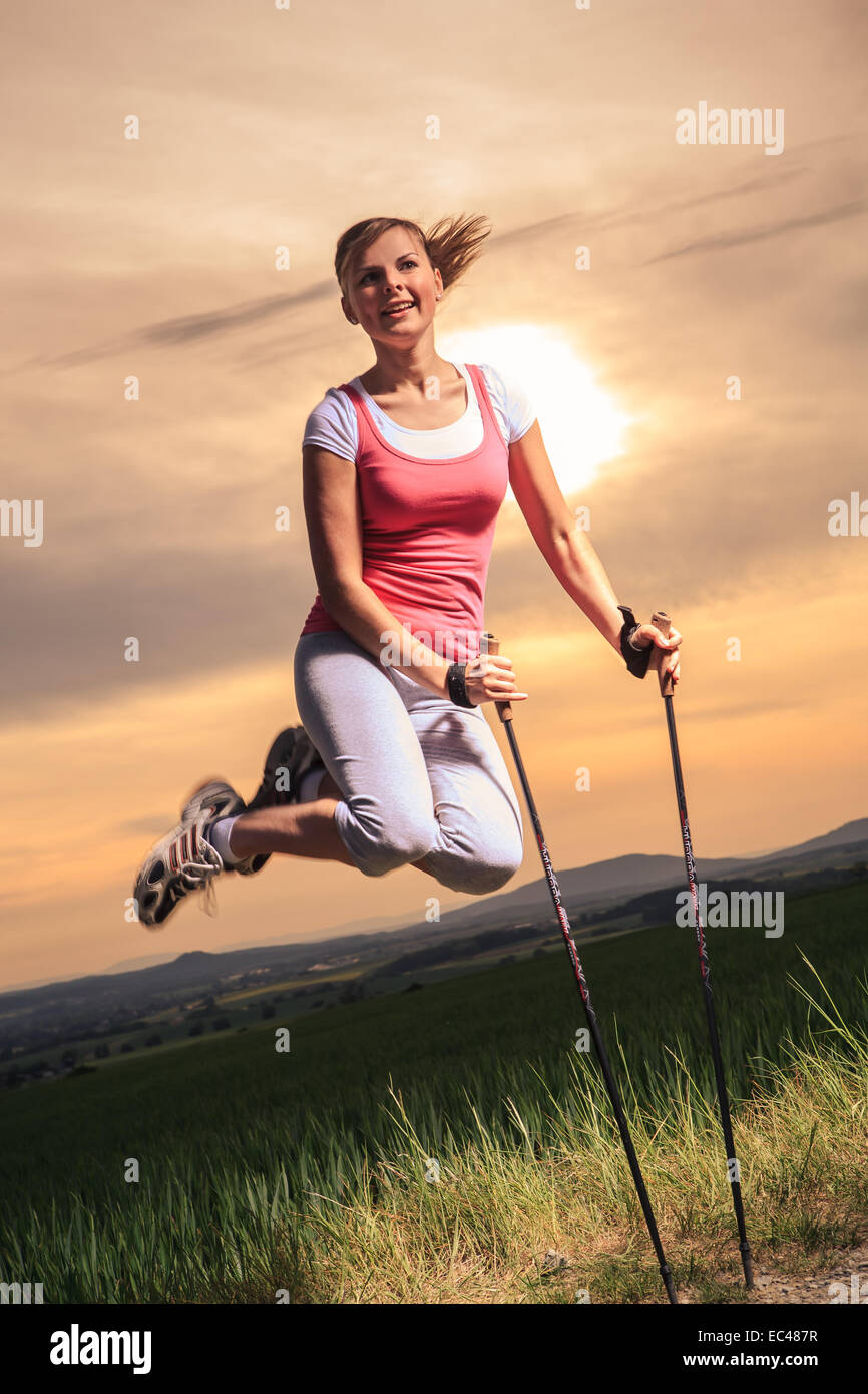 Young woman stretching nordic walking hi-res stock photography and ...