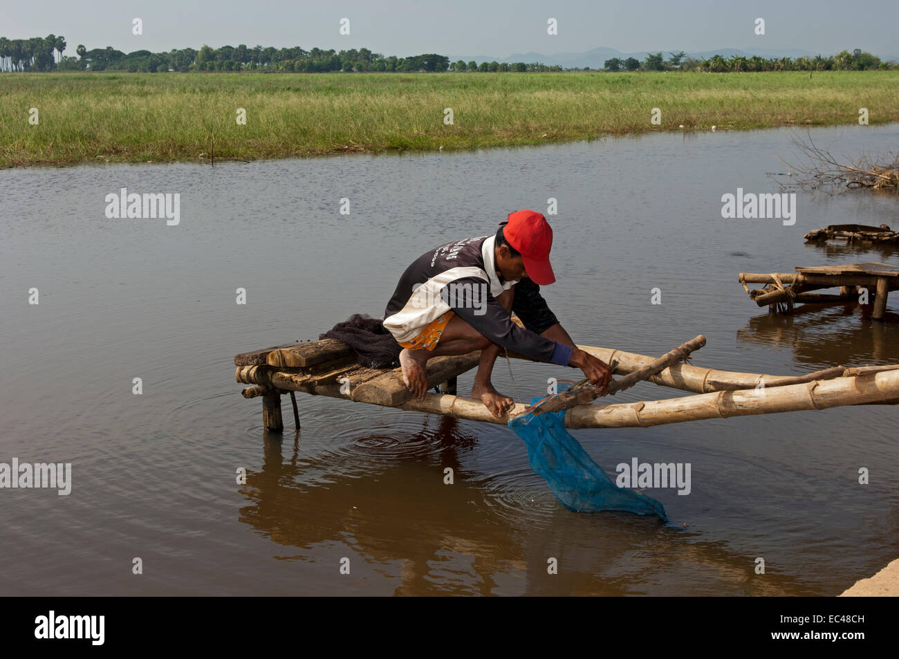 Man Throwing Cast Net On High Resolution Stock Photography and Images ...