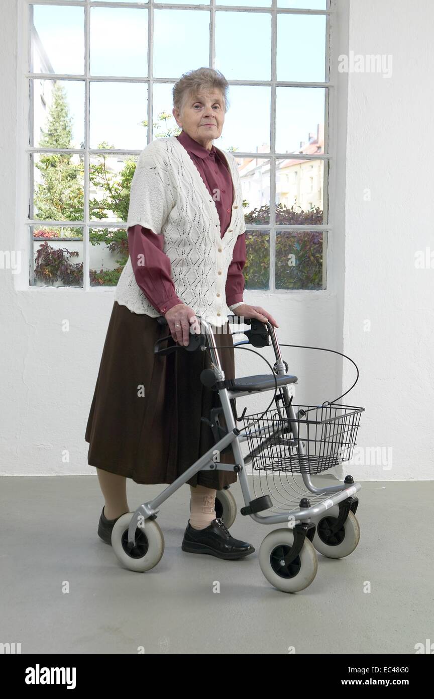 Aged Woman with Walker Stock Photo - Alamy