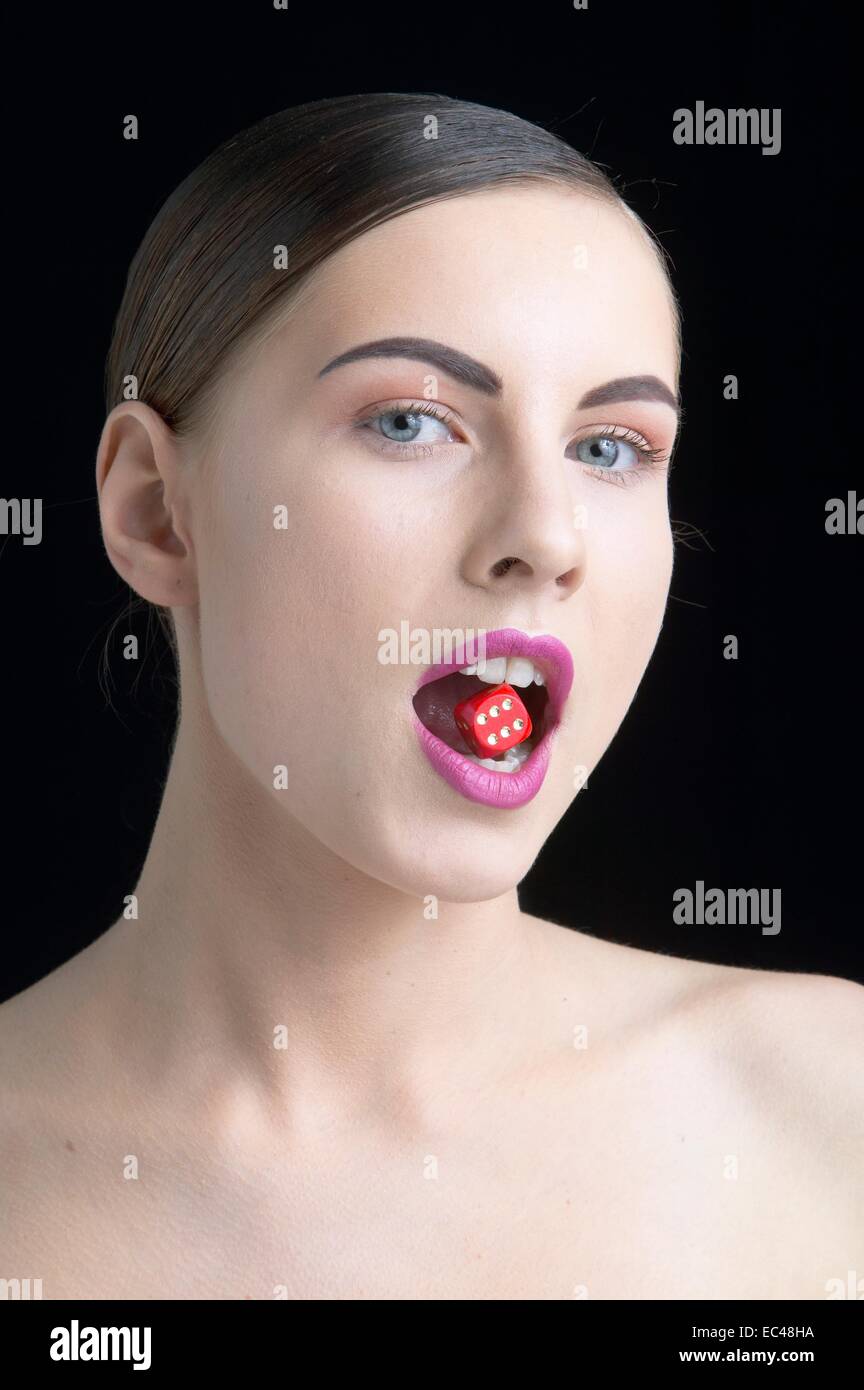 Woman dice in mouth hi-res stock photography and images - Alamy