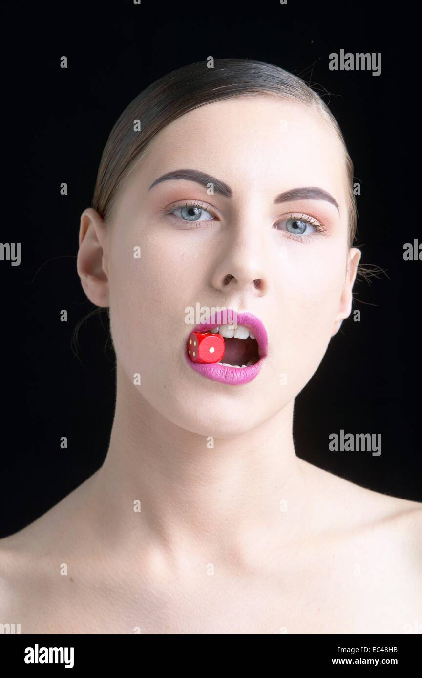 Woman dice in mouth hi-res stock photography and images - Alamy
