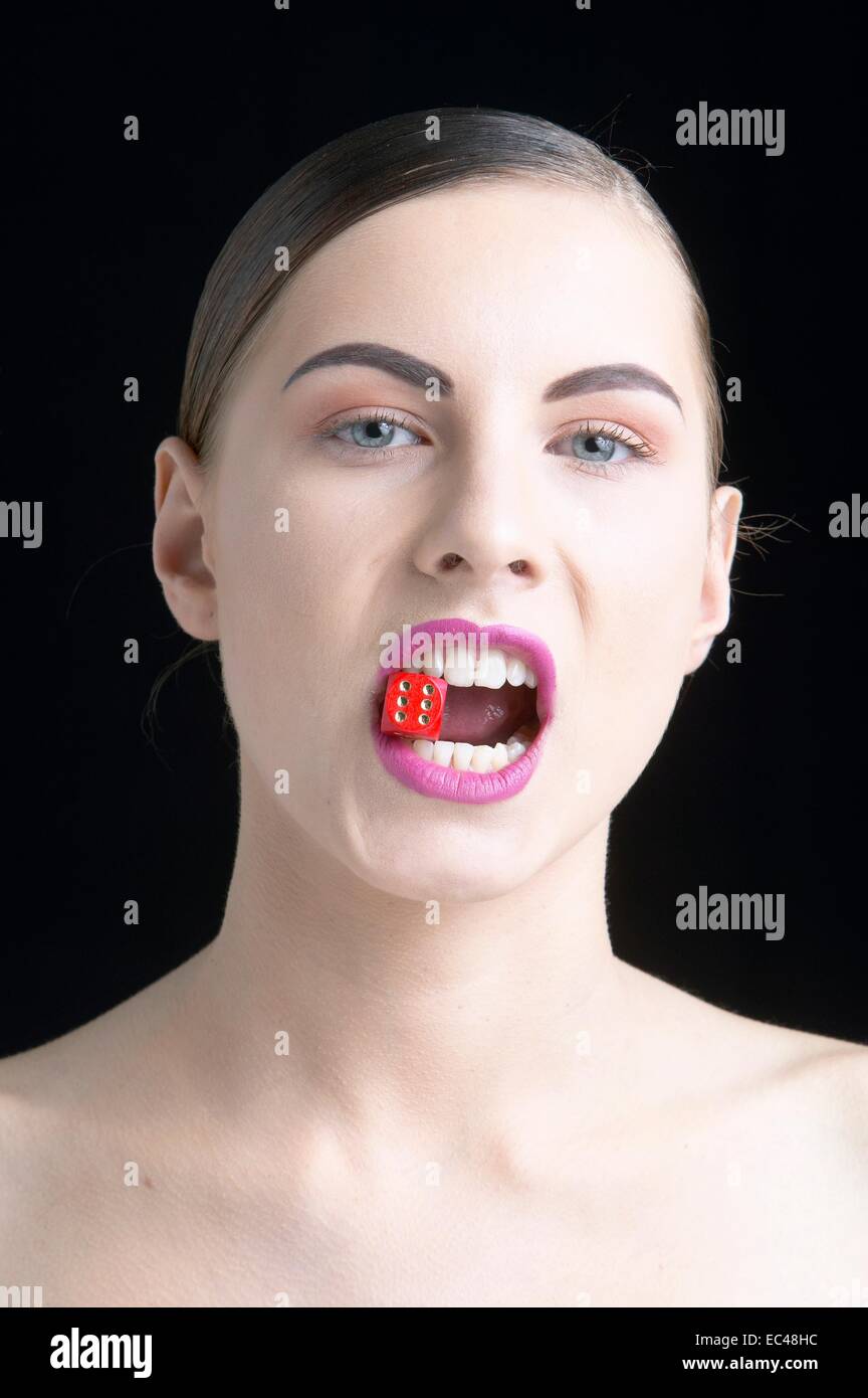 Woman dice in mouth hi-res stock photography and images - Alamy