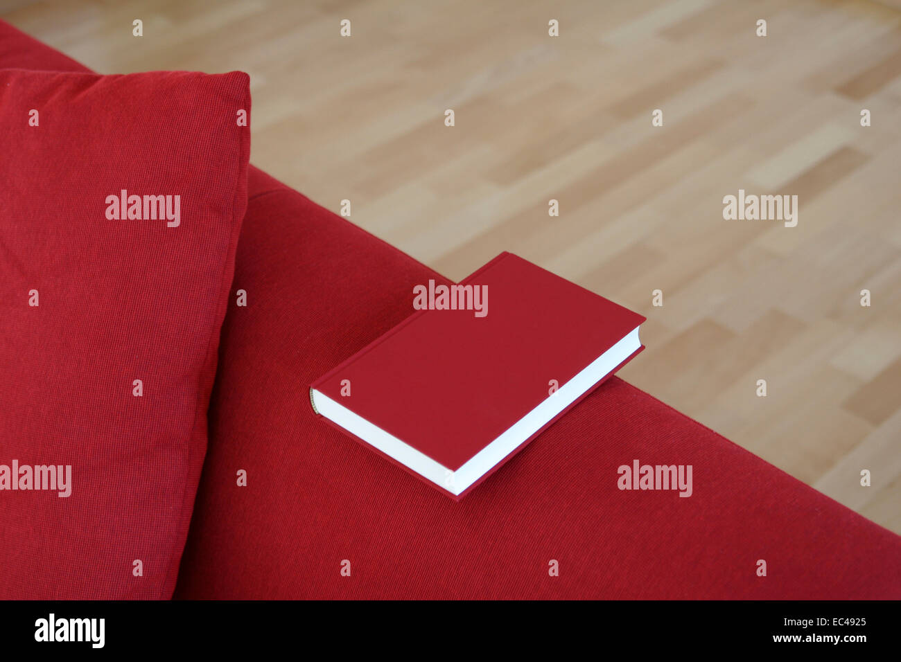 Book on the sofa Stock Photo - Alamy