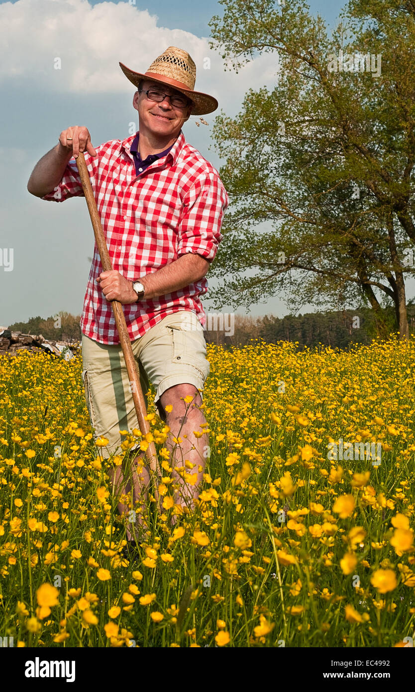 The farmer with his pitchfork Stock Photo - Alamy