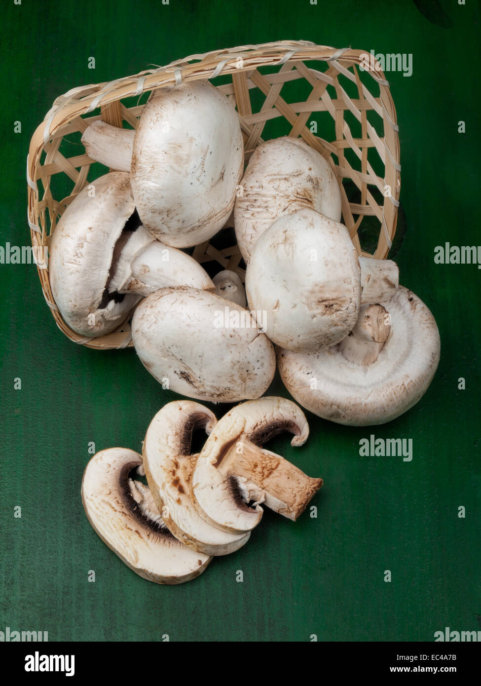 whole and sliced champignon mushrooms on wood Stock Photo - Alamy