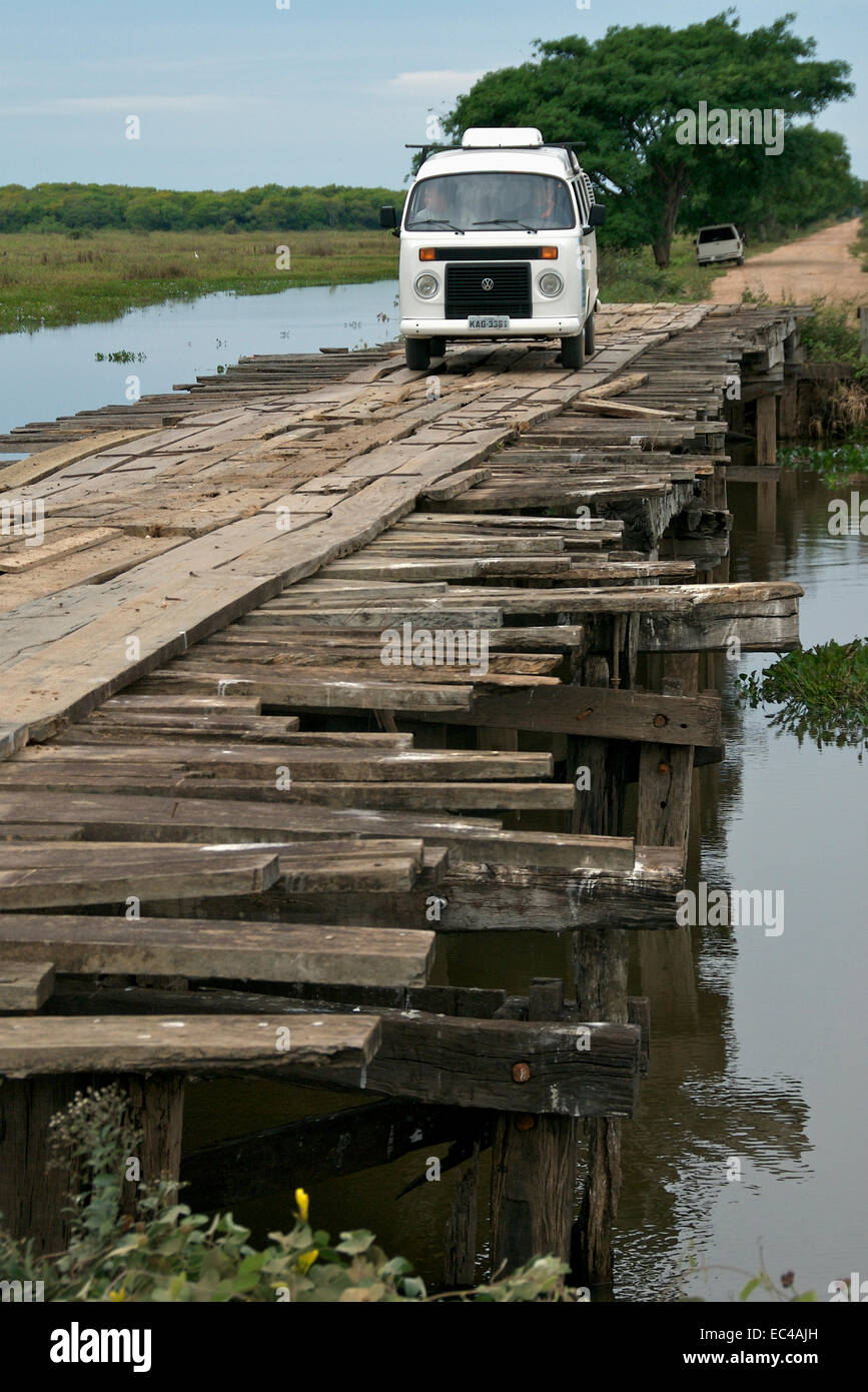 Car drives over a timber bridge in the Pantanal, Brazil Stock Photo - Alamy