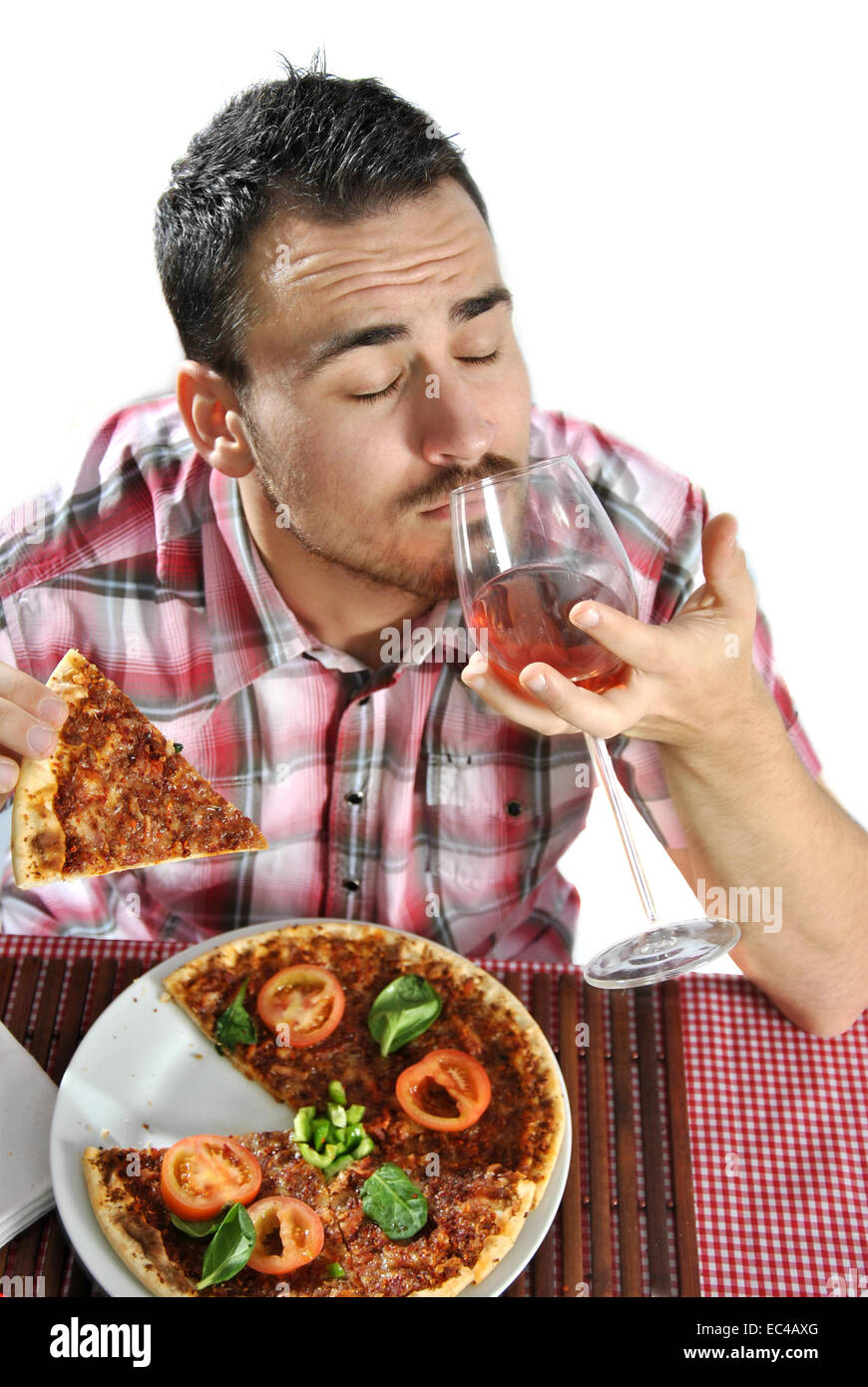 Crazy hungry man eating pizza in a restaurant Stock Photo - Alamy