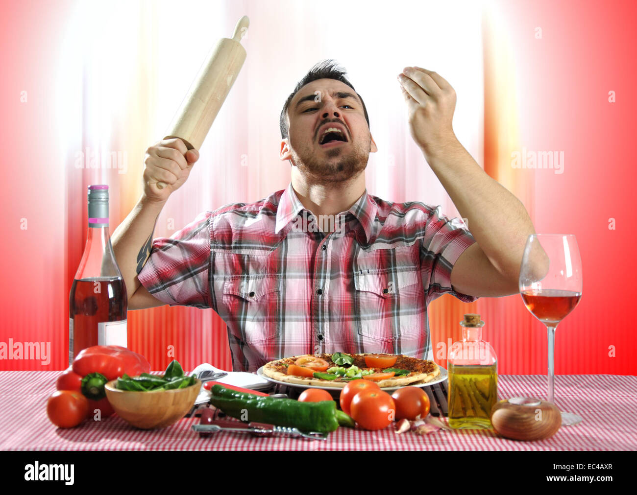 Crazy hungry man eating pizza in a restaurant Stock Photo - Alamy