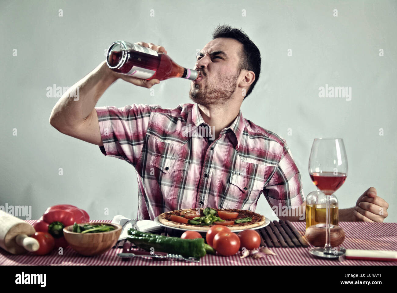 Crazy hungry man eating pizza hi-res stock photography and images - Alamy