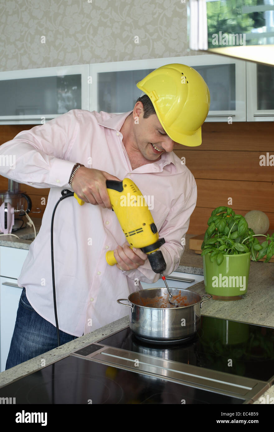 Man Cooking with Borer Stock Photo - Alamy