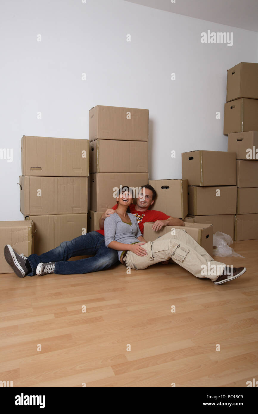 Young Couple Moving Home, Rest Stock Photo - Alamy