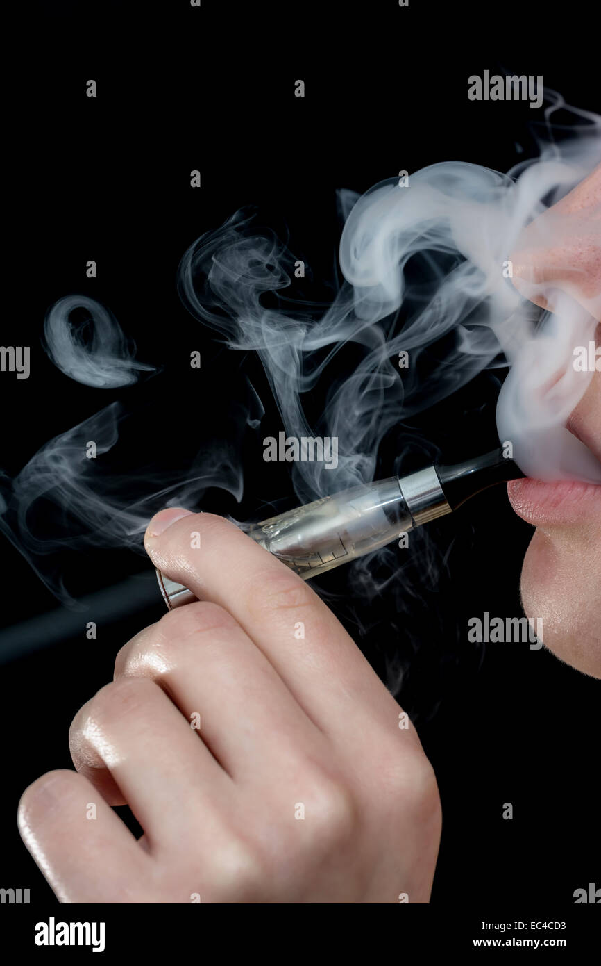 Closeup detail of Female with an Electronic Cigarette, Horizontal shot ...