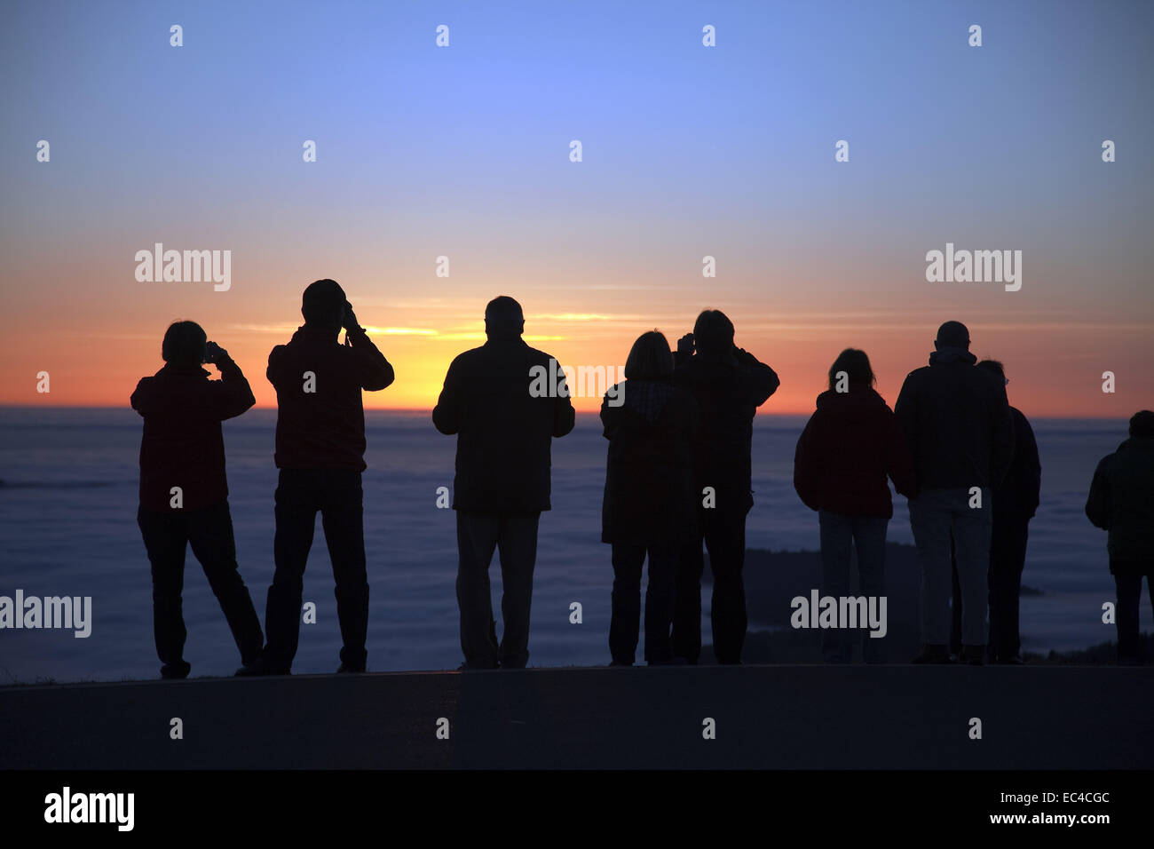 People silhouette against a sunset Stock Photo - Alamy