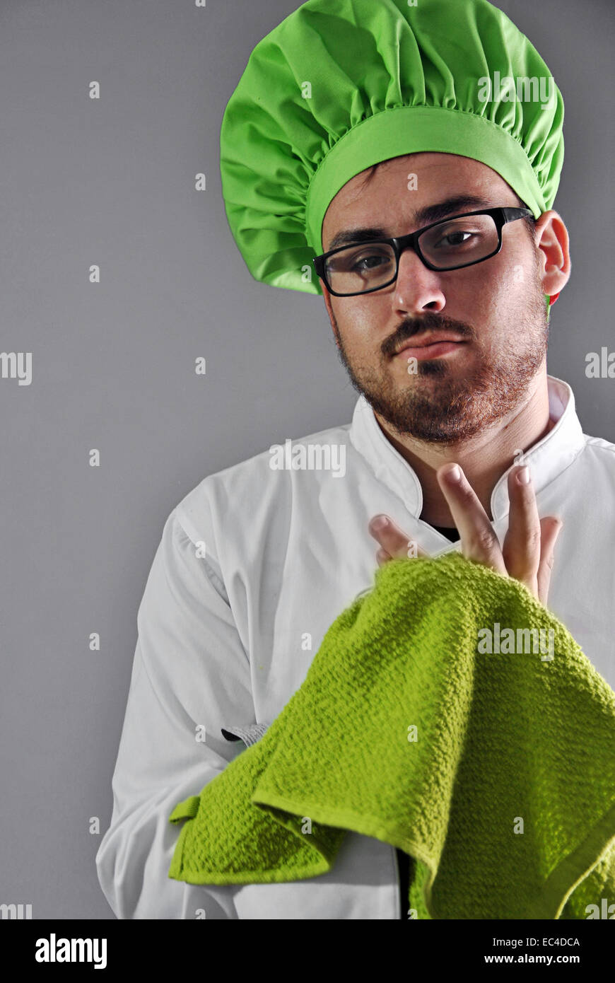 Cook with all his work clothes and cutlery for the kitchen Stock Photo ...