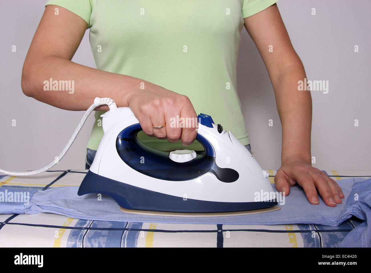 Woman ironing things steam hi-res stock photography and images - Alamy