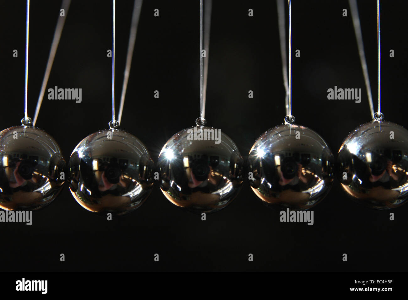 Swinging balls hi-res stock photography and images - Alamy