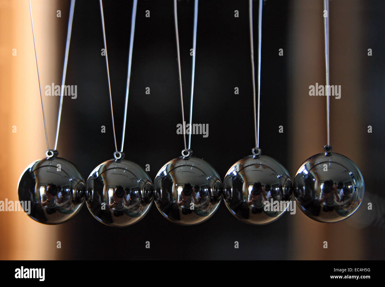 Swinging balls hi-res stock photography and images - Alamy