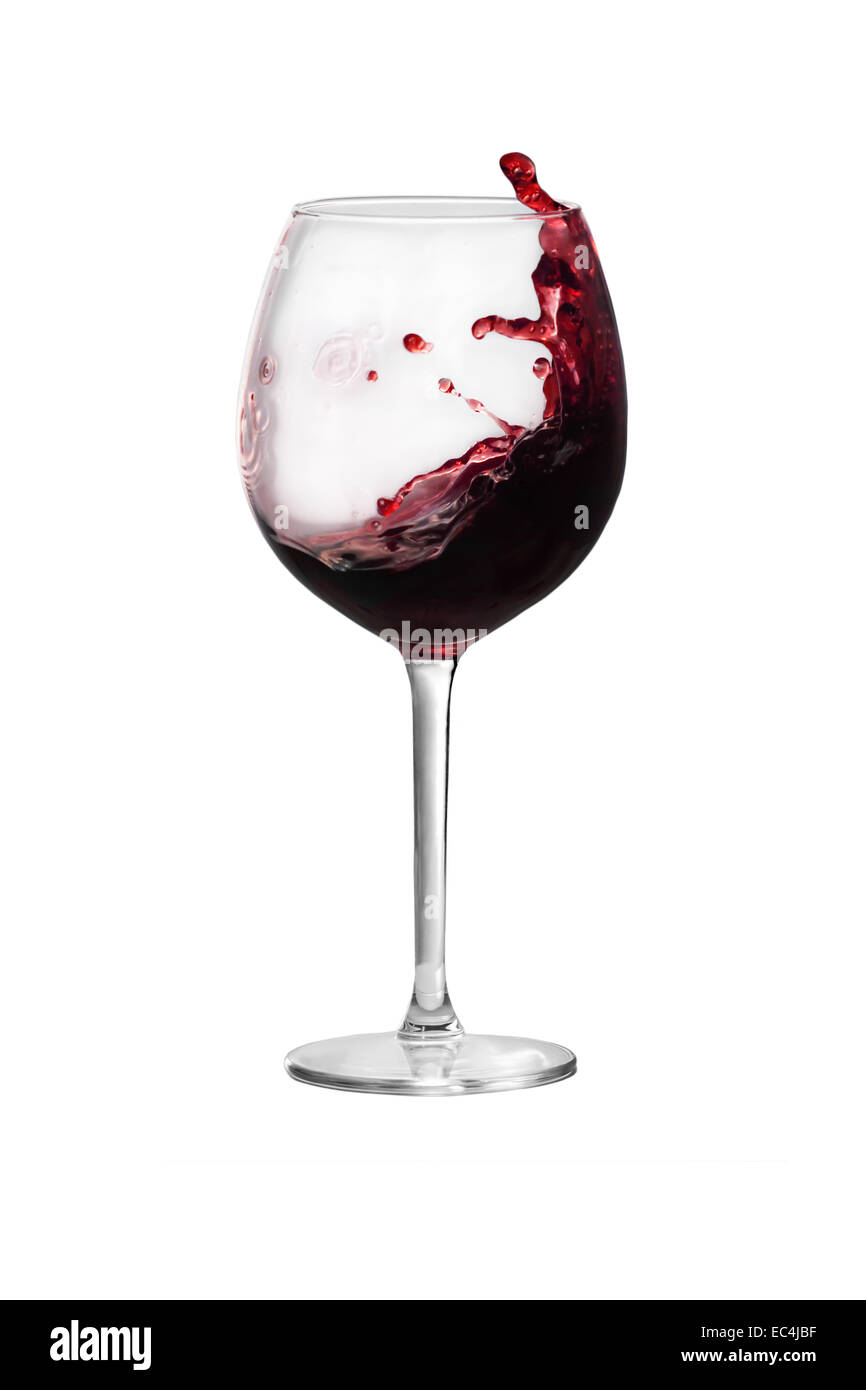 Red wine is splashing out of a wine glass Stock Photo - Alamy
