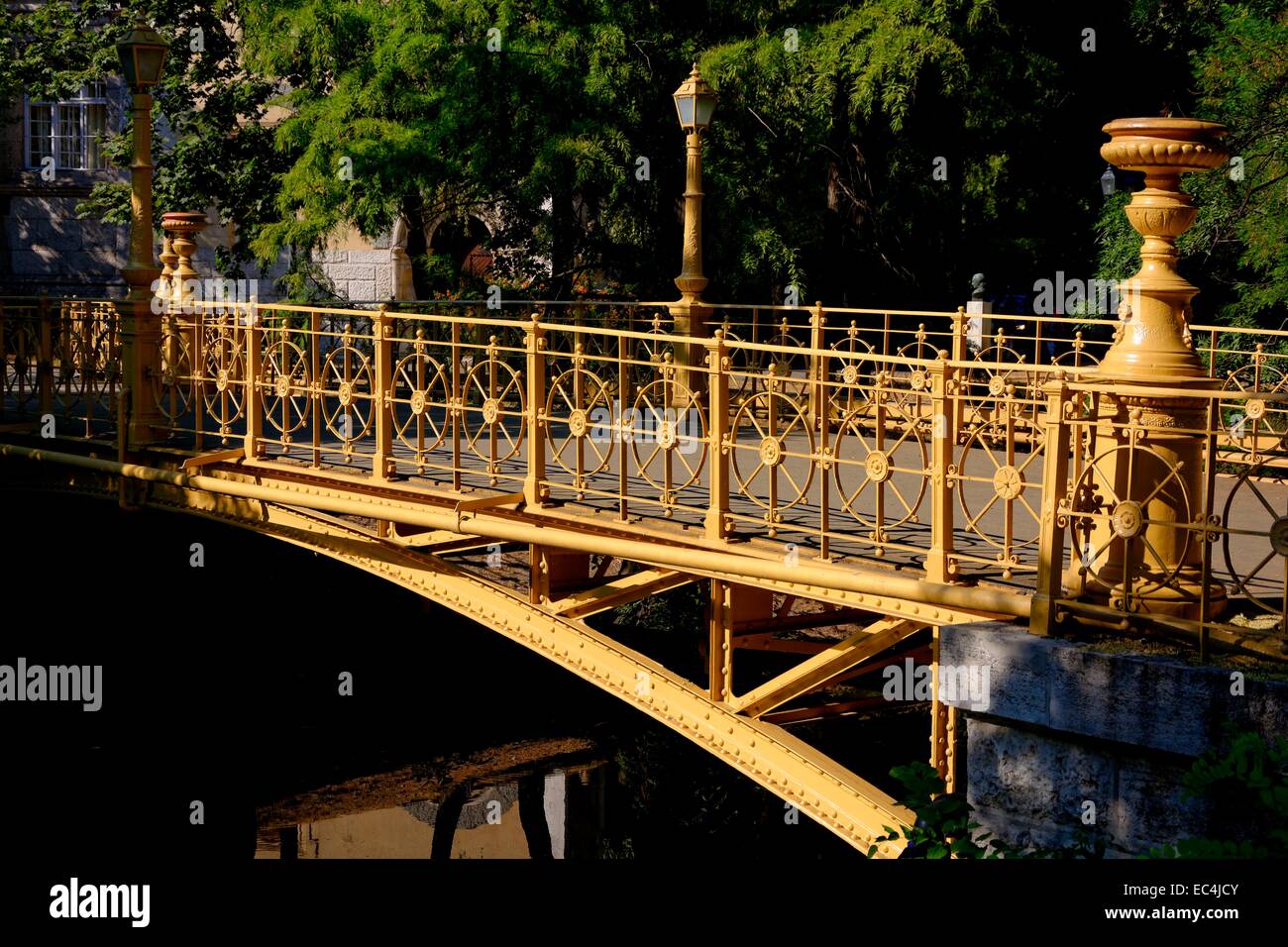 Historic ochre-coloured iron bridge with bridge lanterns Stock Photo ...