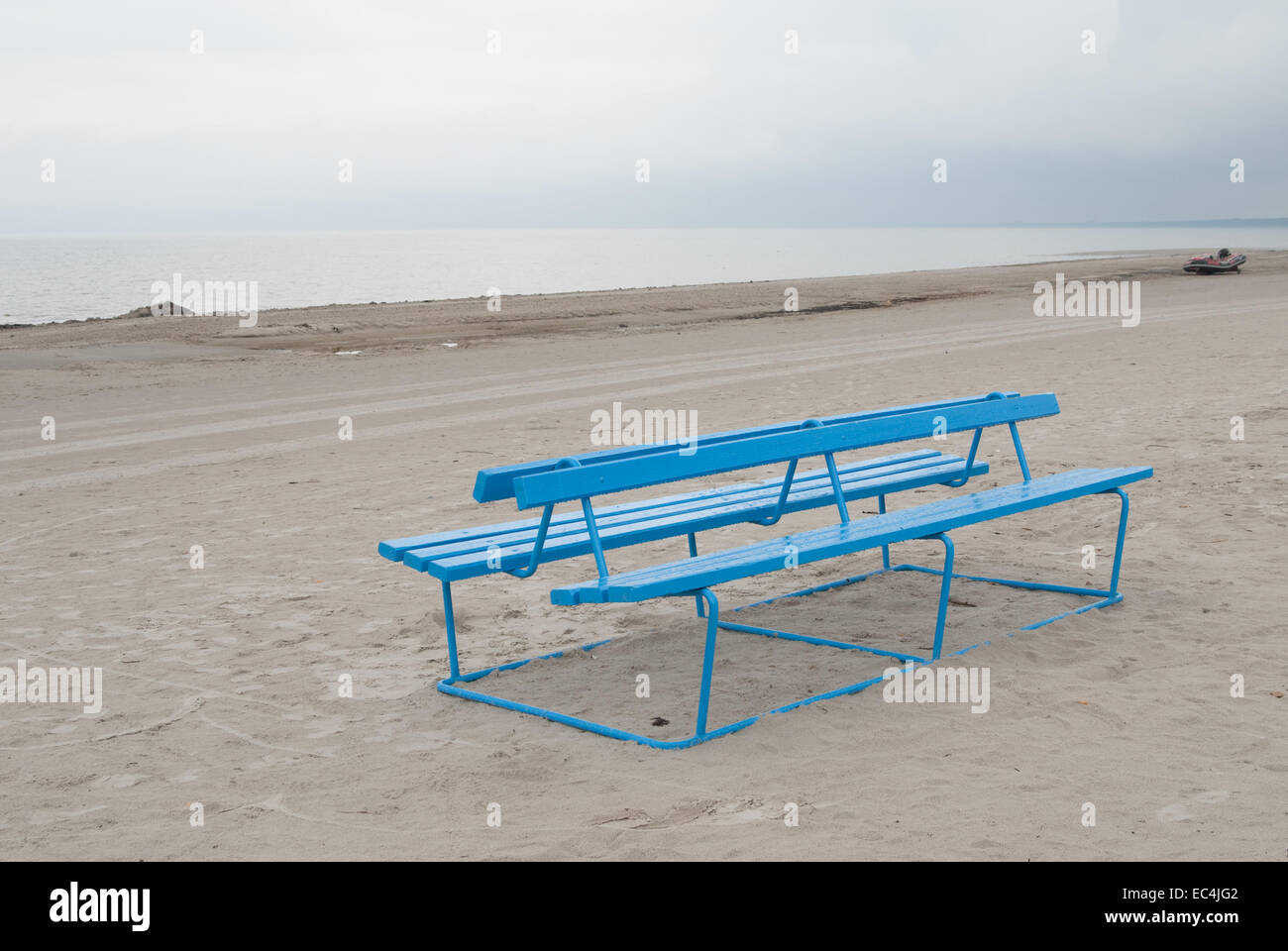 Blue park bench at the beach Stock Photo - Alamy