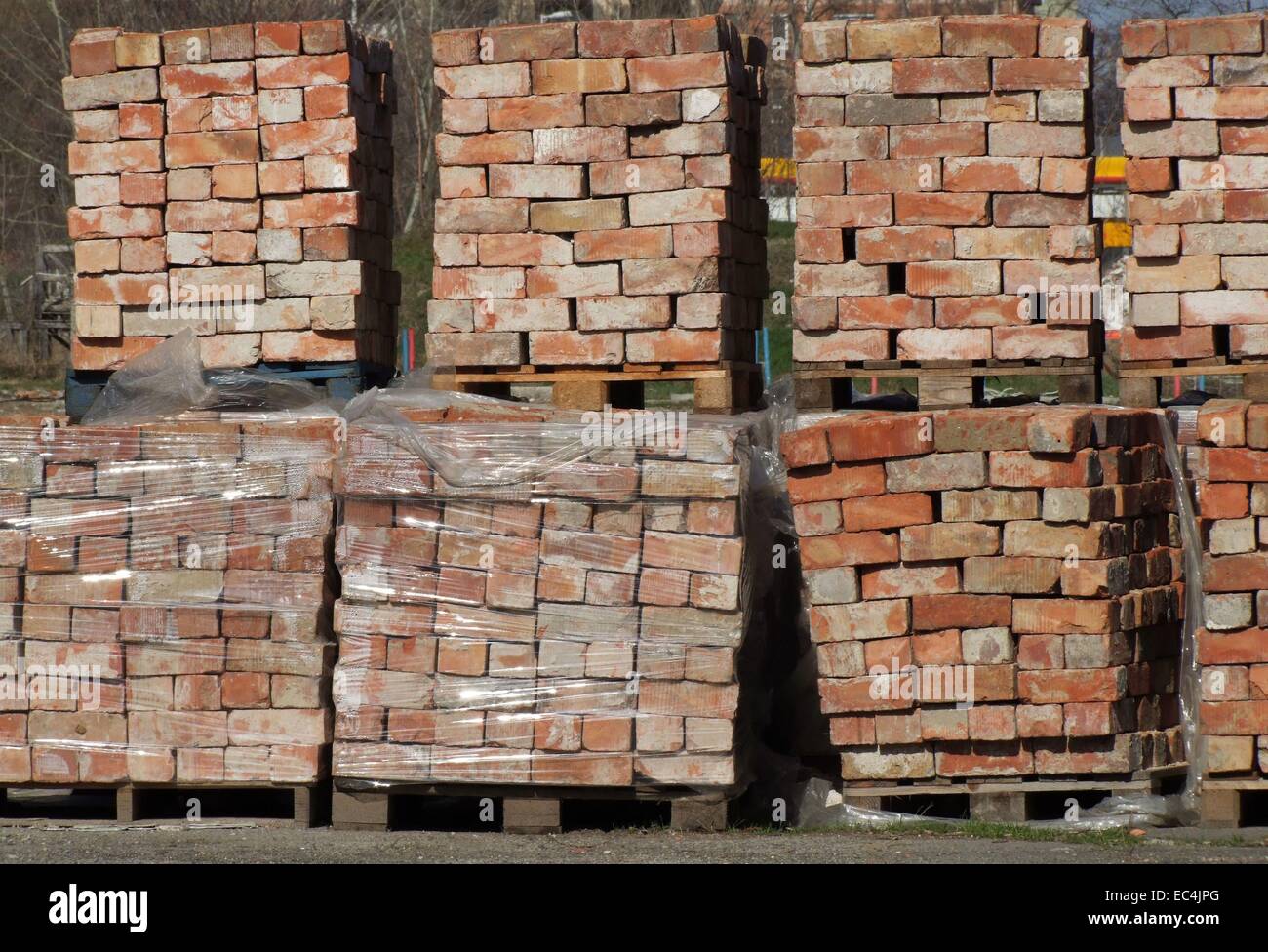 Pile of old, used bricks partly wrapped in nylon Stock Photo - Alamy