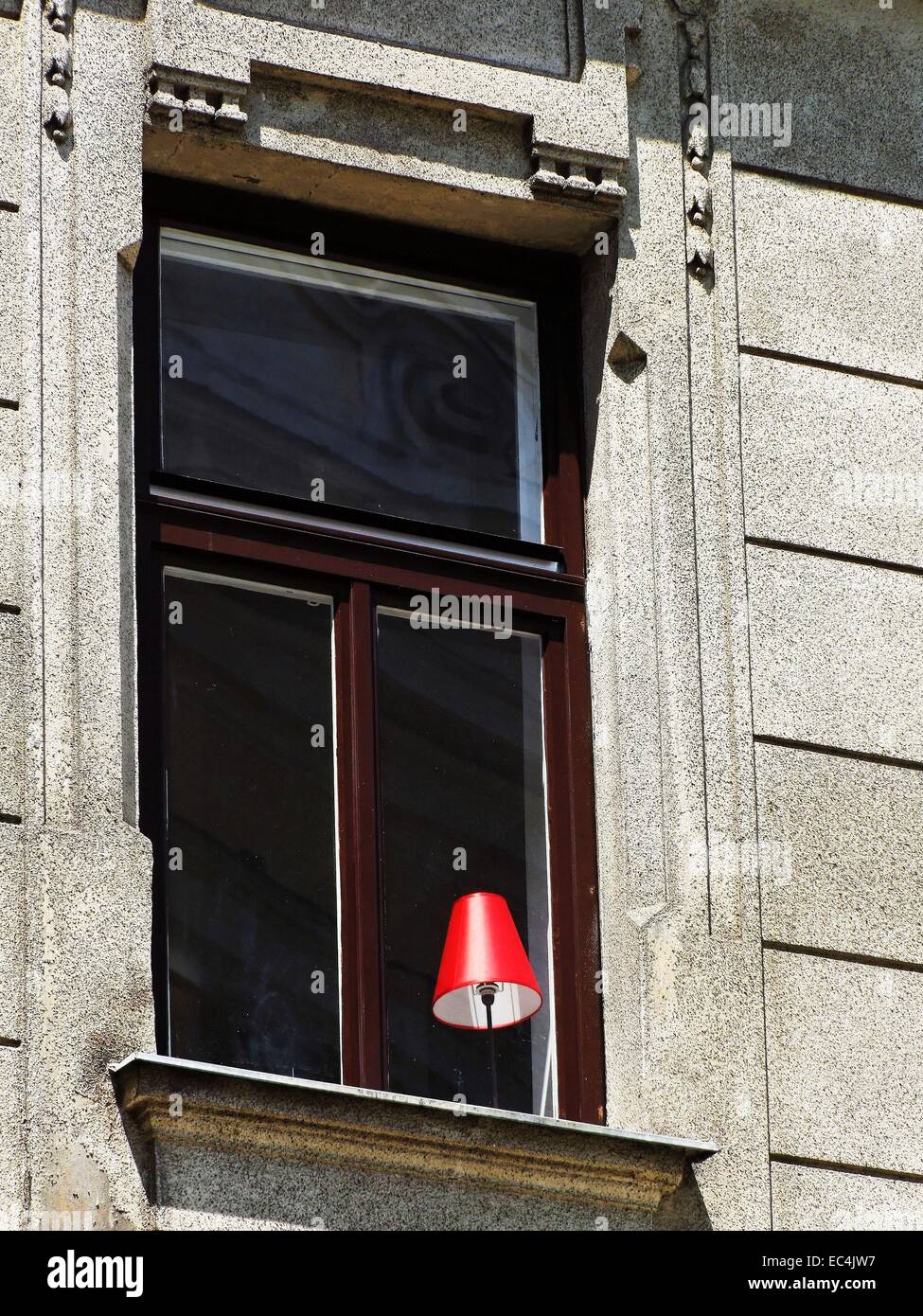 A red light behind a window Stock Photo - Alamy