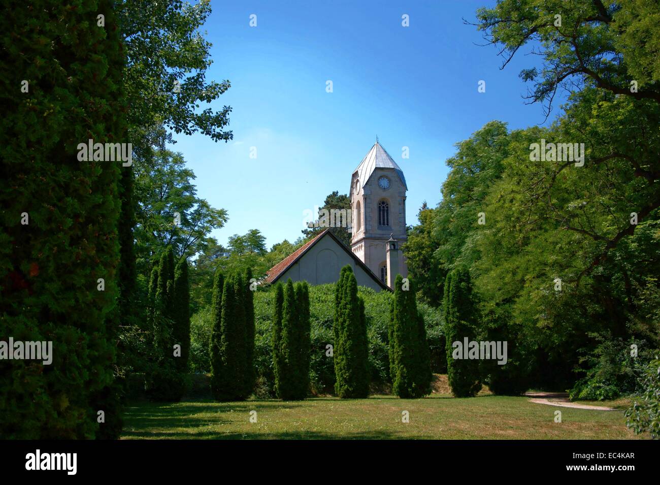 Chapel architecture in neo-Romanesque style in the Park. Blue skies and ...