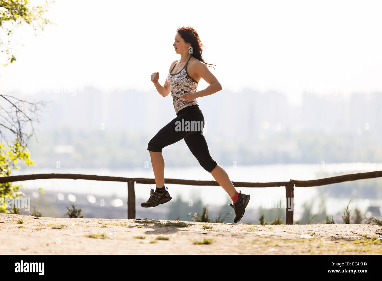 Young woman athlete running in the morning Stock Photo - Alamy
